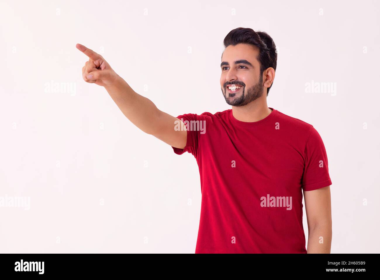 A HAPPY MAN STANDING AND POINTING AWAY Stock Photo - Alamy