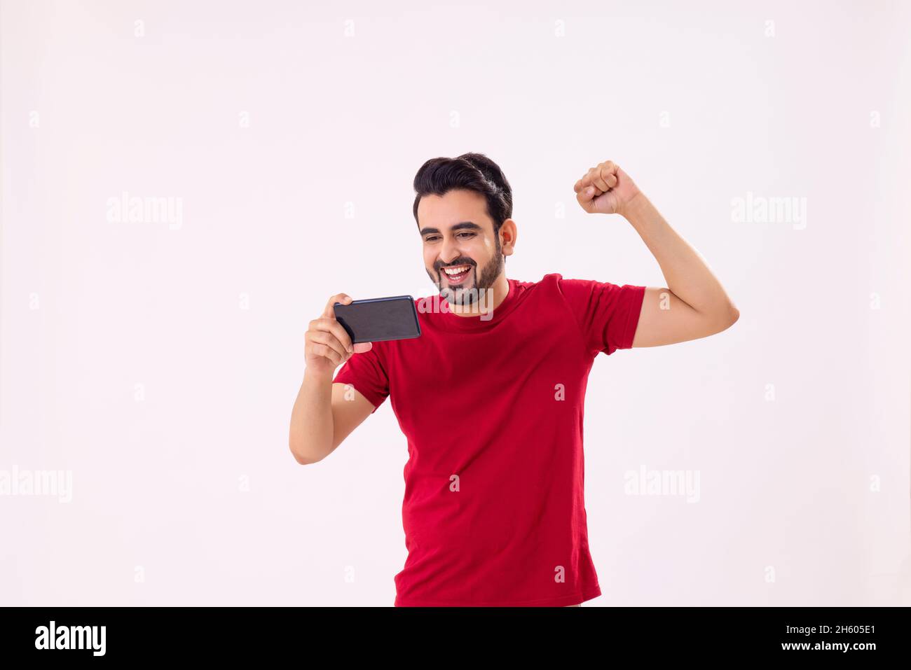 Watching mobile phone studio hi-res stock photography and images - Alamy