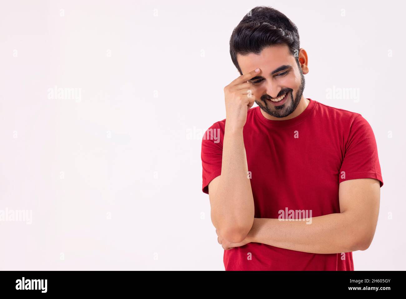 A HAPPY MAN LAUGHING AND LOOKING DOWN Stock Photo - Alamy