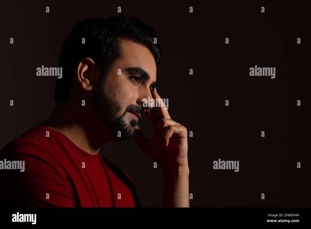 A MAN THINKING SERIOUSLY WHILE ALONE Stock Photo - Alamy