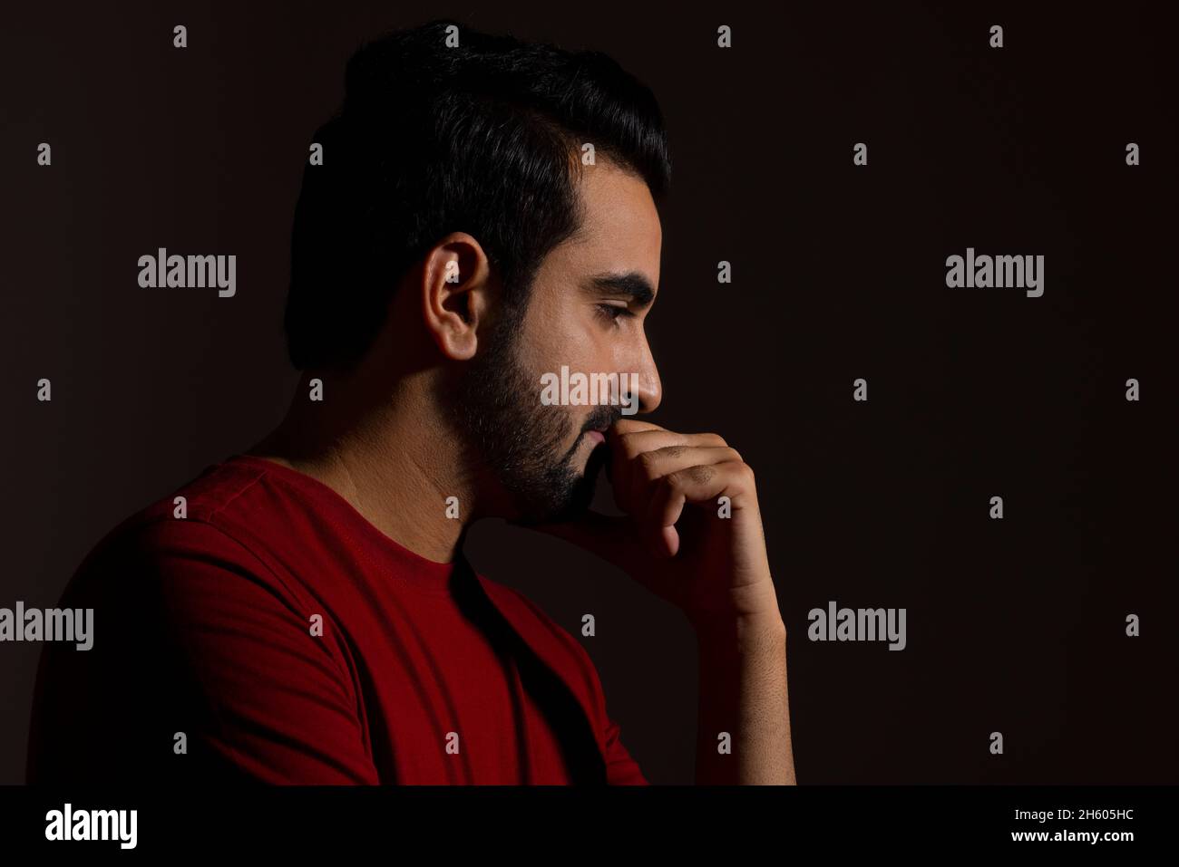 PORTRAIT OF A MAN THINKING SERIOUSLY WHILE ALONE Stock Photo - Alamy