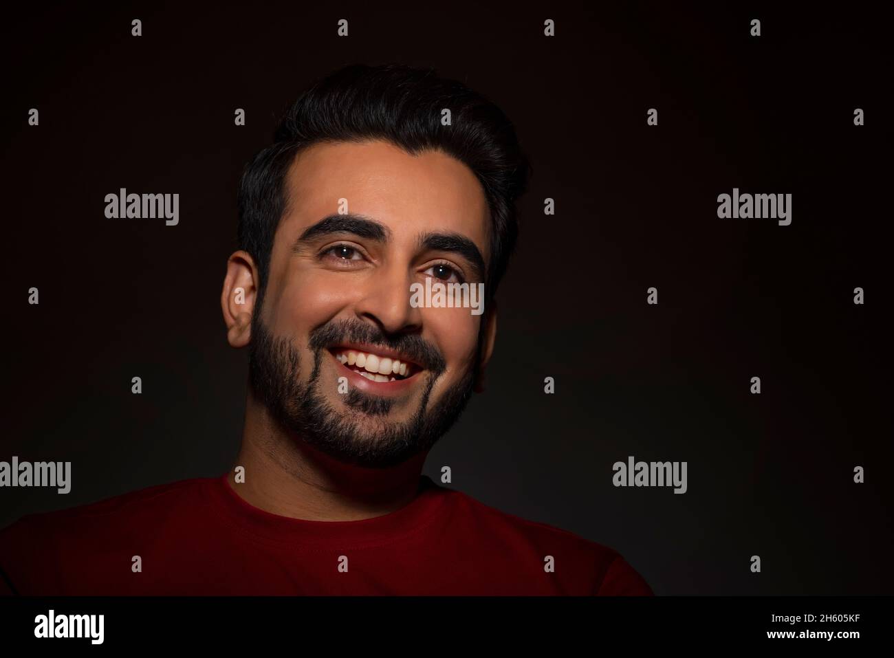 A HAPPY MAN LOOKING ABOVE AND POSING Stock Photo - Alamy