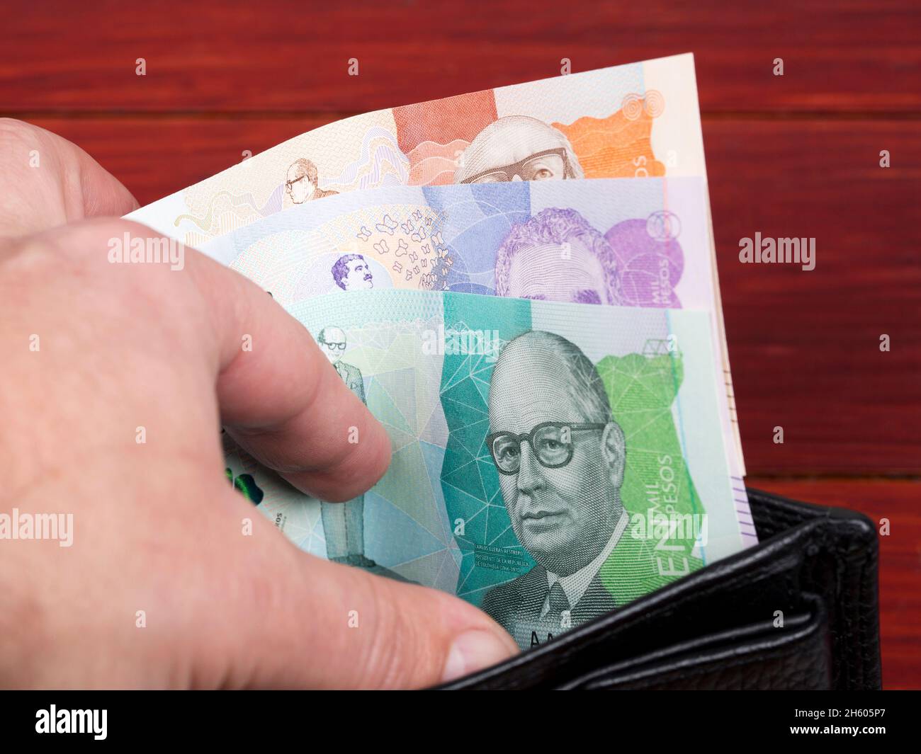 Colombian money - peso in the black wallet Stock Photo - Alamy