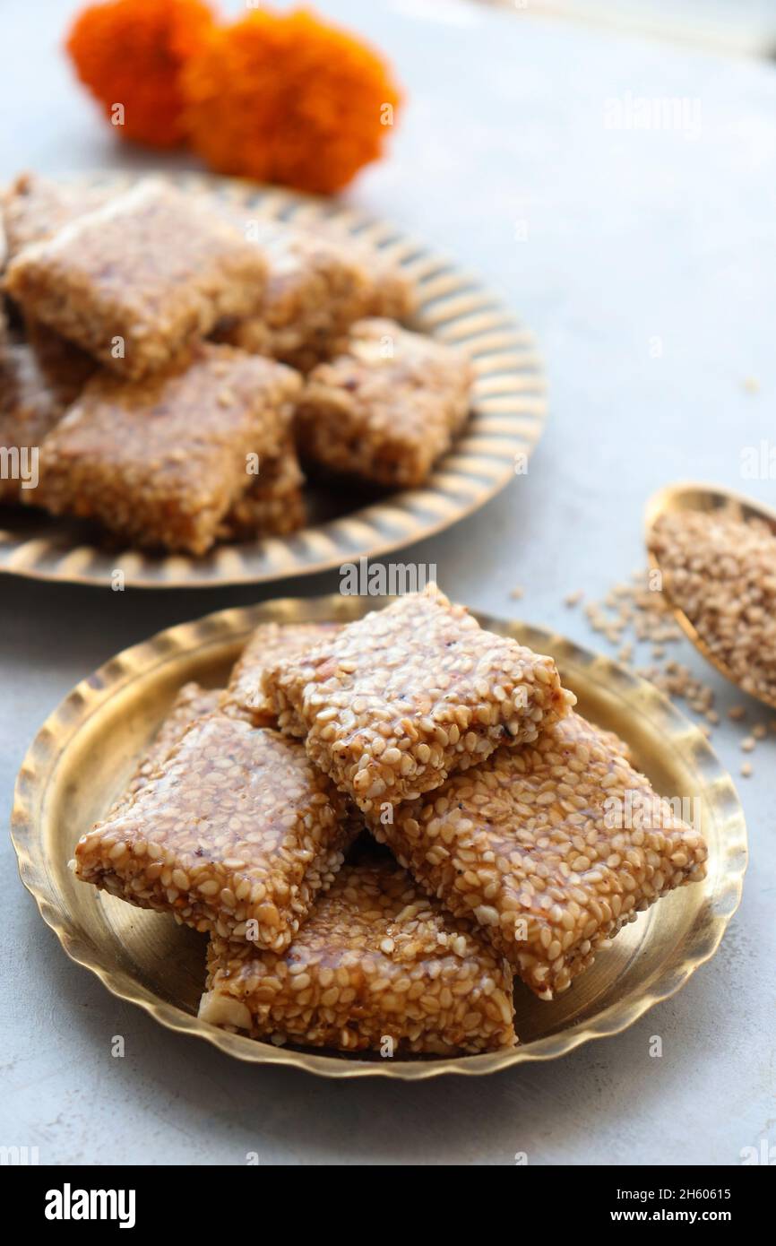 Indian makar sankranti festival food or sweets. Tilgul in a small brass ...
