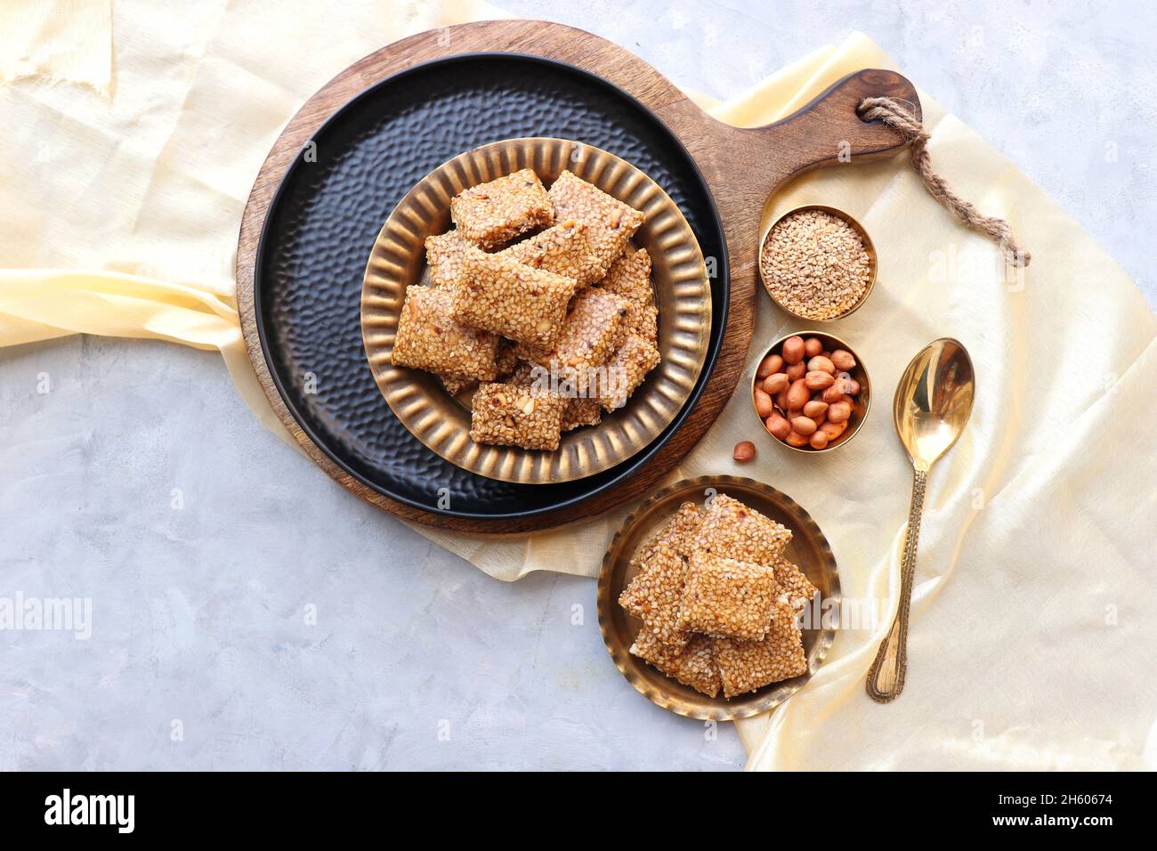 Indian makar sankranti festival food or sweets. Tilgul in a small brass ...