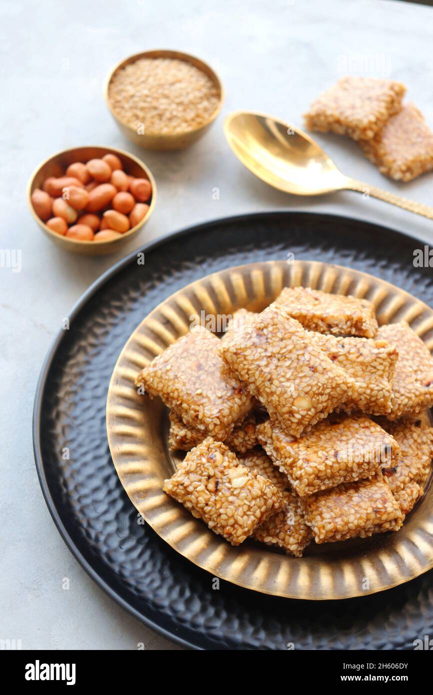Indian makar sankranti festival food or sweets. Tilgul in a small brass ...