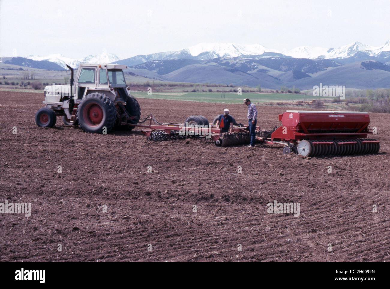 Men in field working on disc, connected to a tractor May 1992 Stock ...
