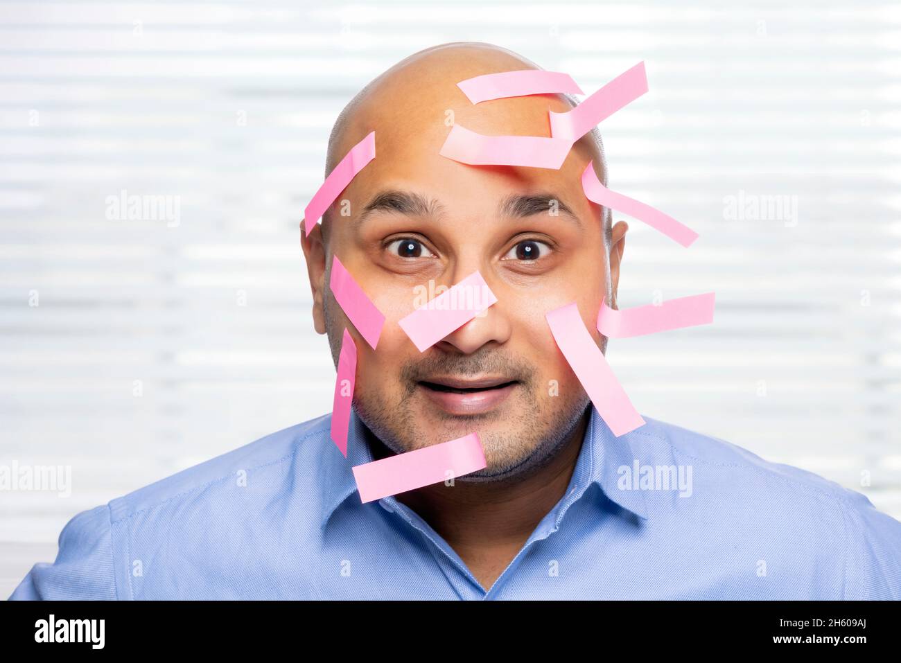 Portrait of a bald man with sticky notes on face, smiling Stock Photo ...