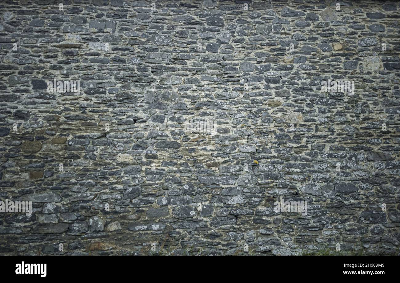 Close-up shot of a medieval rough gray wall, perfect full-frame ...