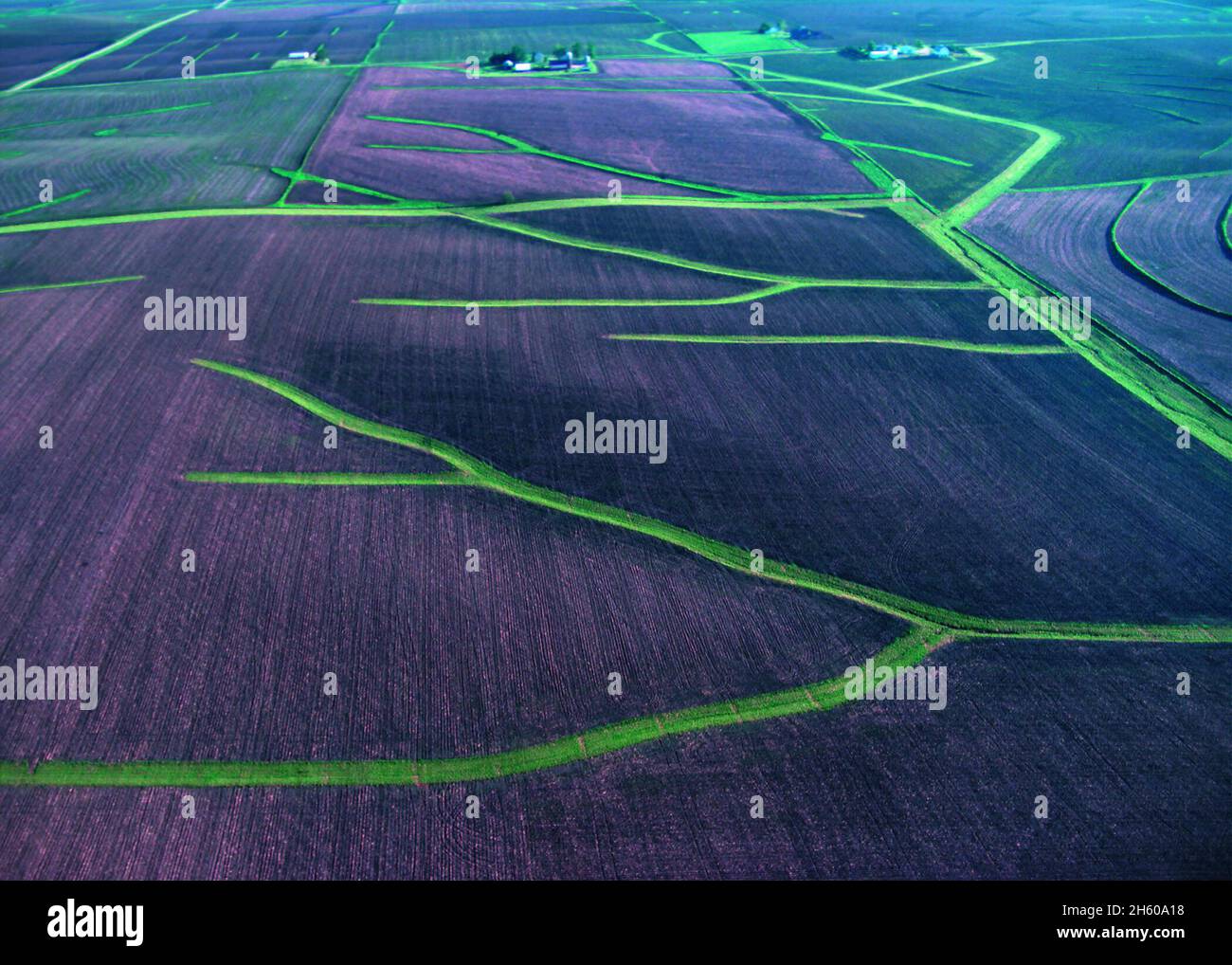 Grassed waterways carry runoff from crop fields preventing erosion ca ...