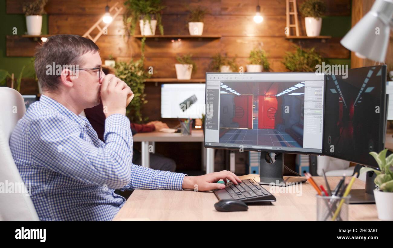 Game creator developing 3d videogame working at graphic ilustration in ...