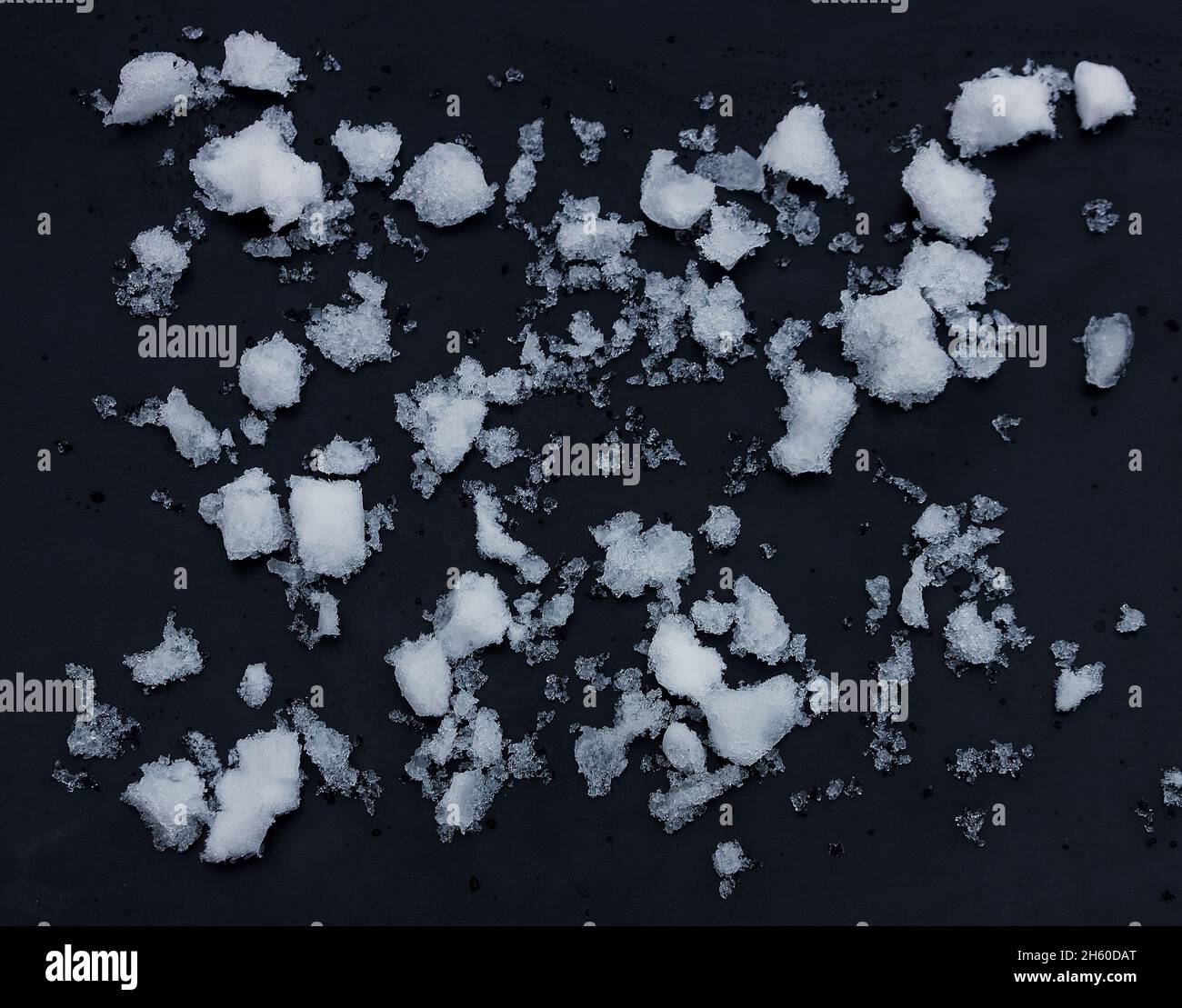 snow chunks lumps texture of snow on a black background Stock Photo - Alamy