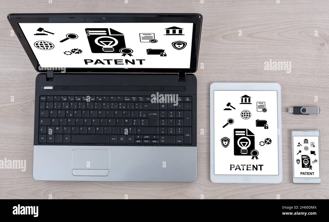 Patent concept shown on different information technology devices Stock ...