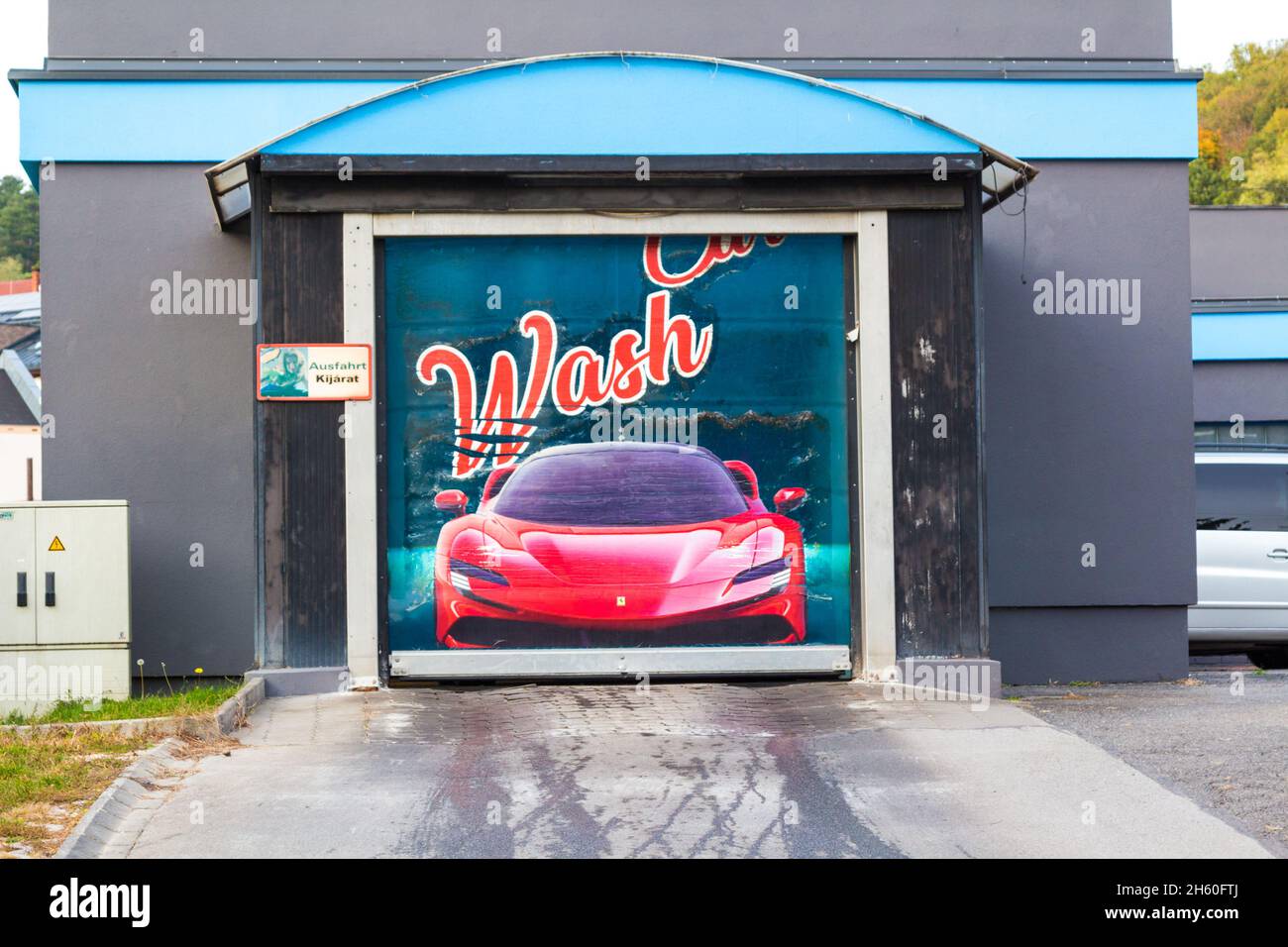 Exit of car wash with image of a Ferrari, Hungary Stock Photo - Alamy