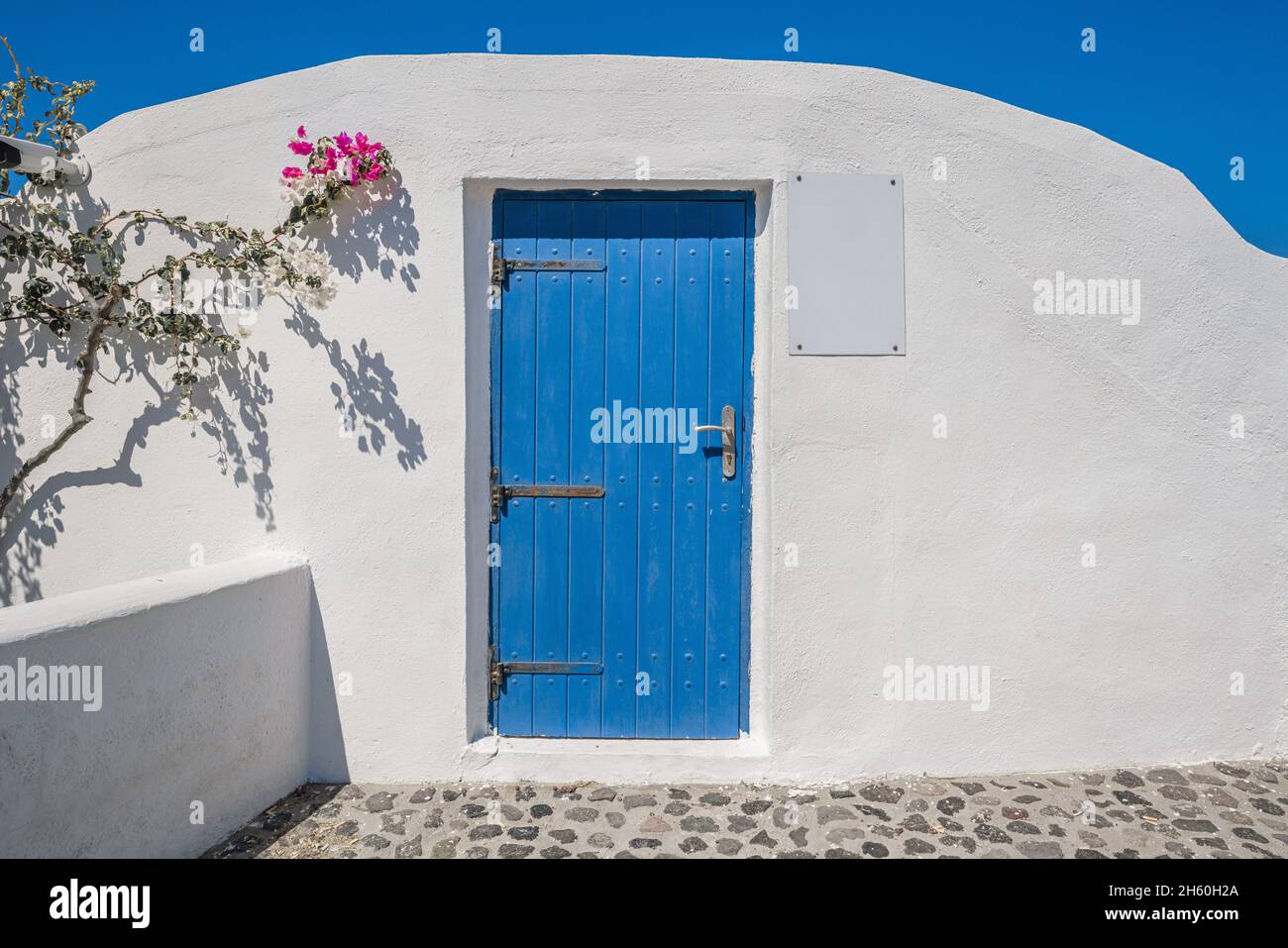 Blue wooden door and wall backgrounds of traditional Greek Island ...