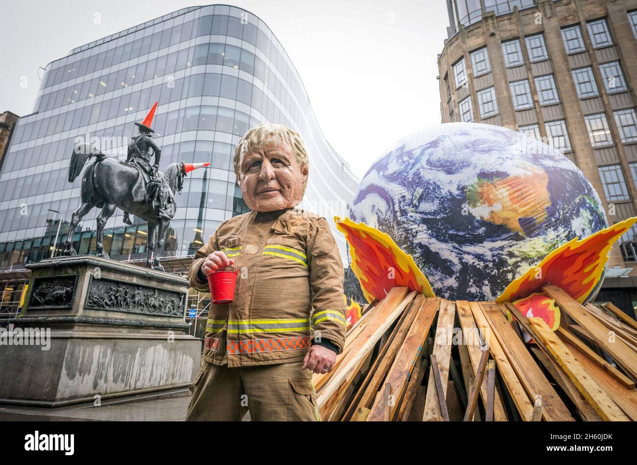 Campaigner wearing a 'big heads' of Boris Johnson takes part in Oxfam's ...