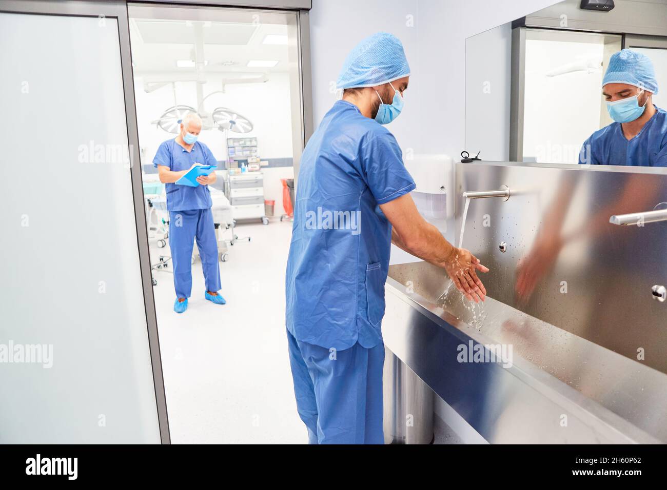 Doctor or nurse washing hands for disinfection and hygiene before the ...