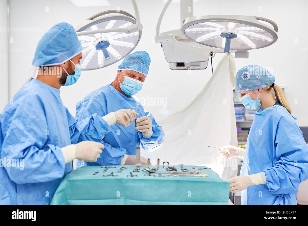The surgeon and interns work together in a concentrated manner during ...