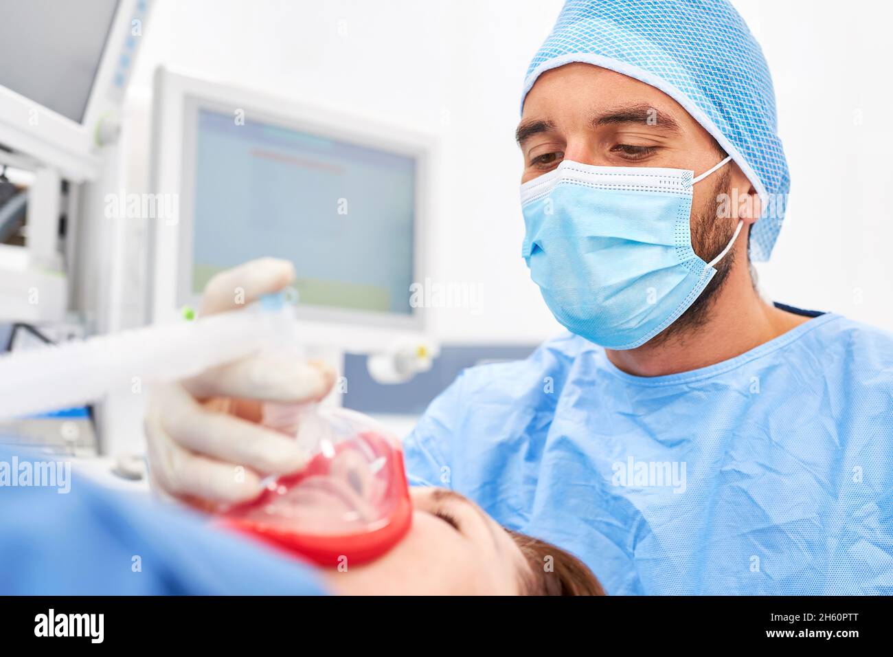 Concentrated anesthesiologist and patient during an operation with ...