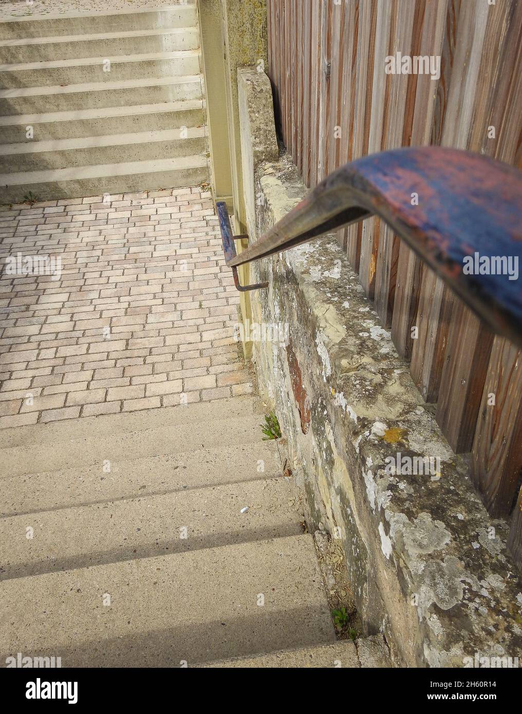 Vertical shot of a rusty handrail leading down the stairs Stock Photo ...