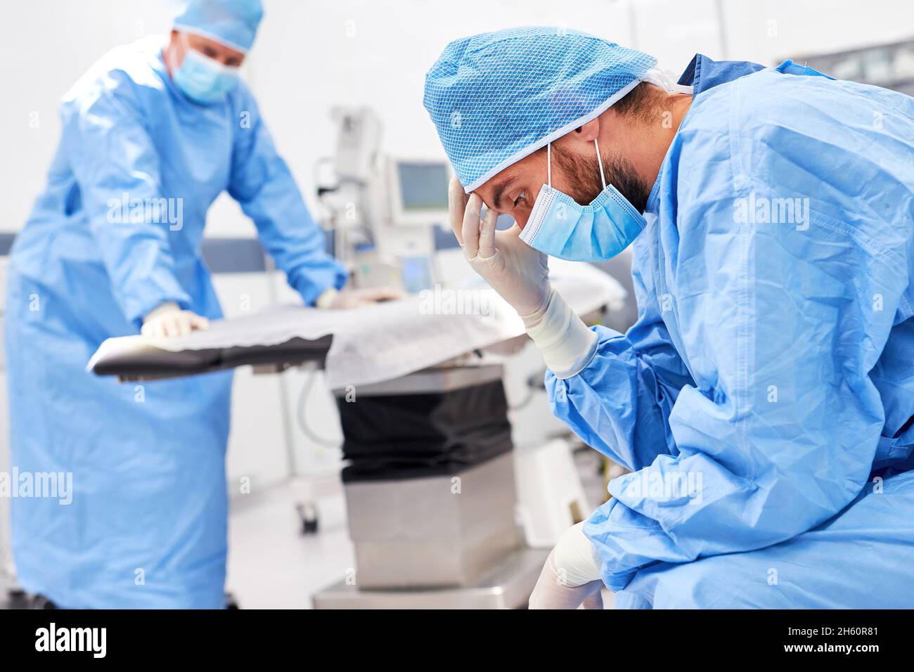 Exhausted clinician after an operation in surgery for overtime and ...