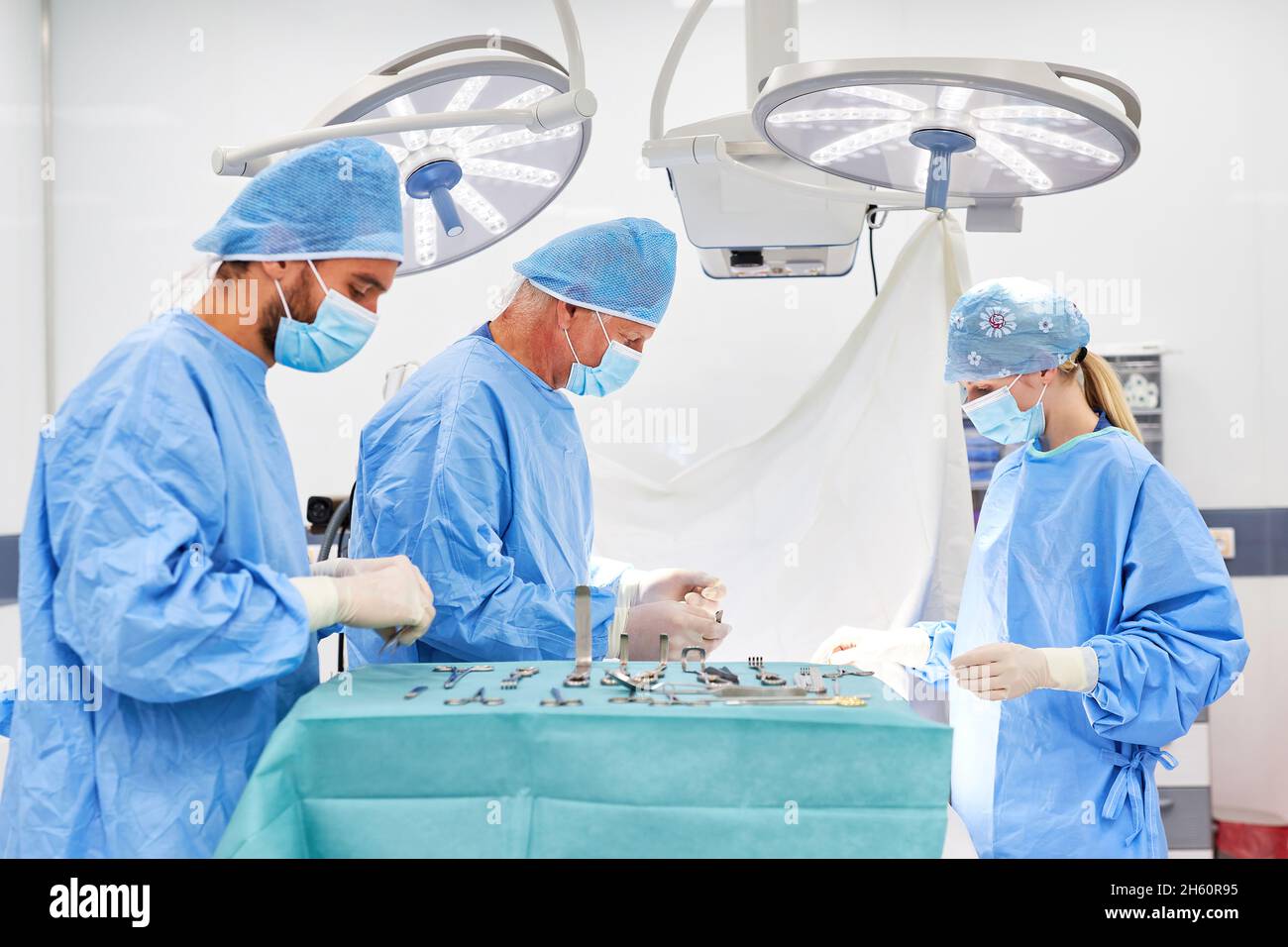 Senior physician and his team are concentrated on an emergency ...