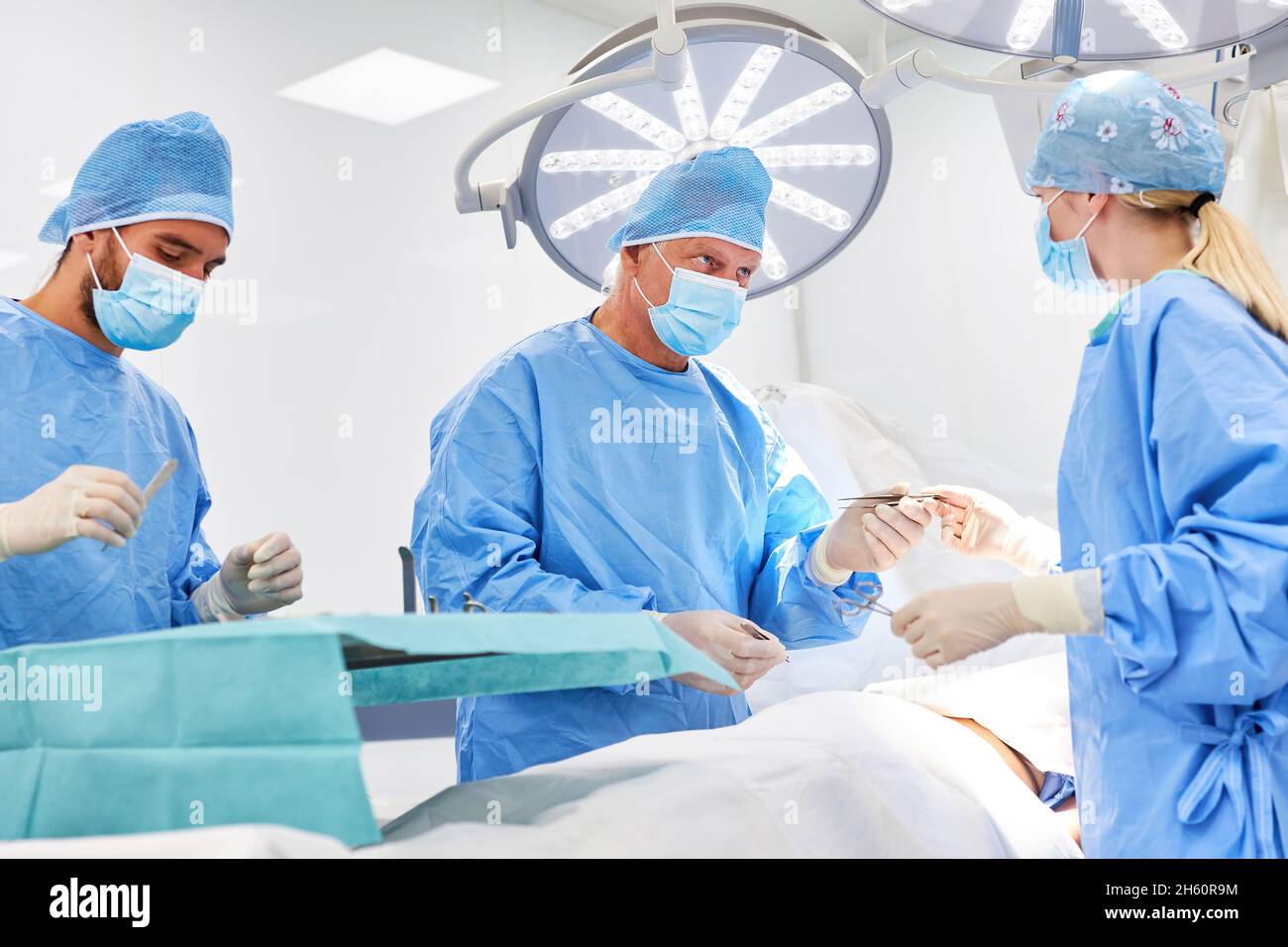 Medical team in surgery during an emergency operation with senior ...