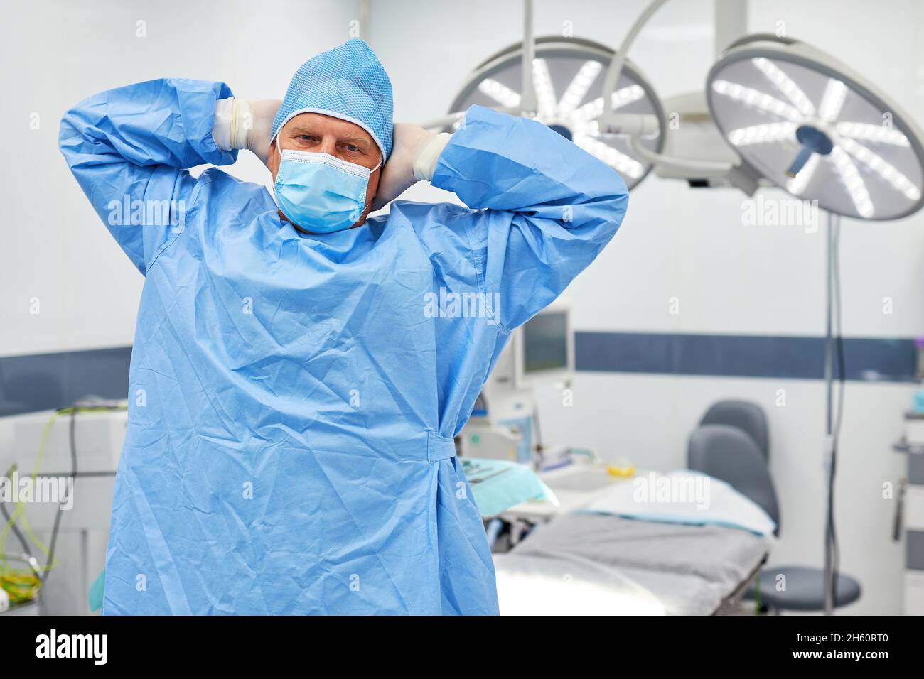 Exhausted surgeon stretching in the emergency room after a strenuous ...