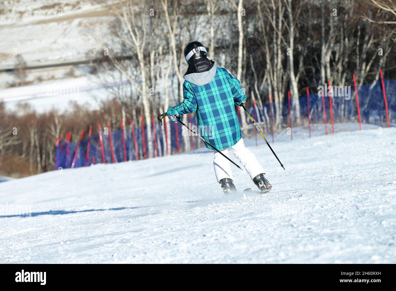 Young woman outdoor skiing Stock Photo - Alamy