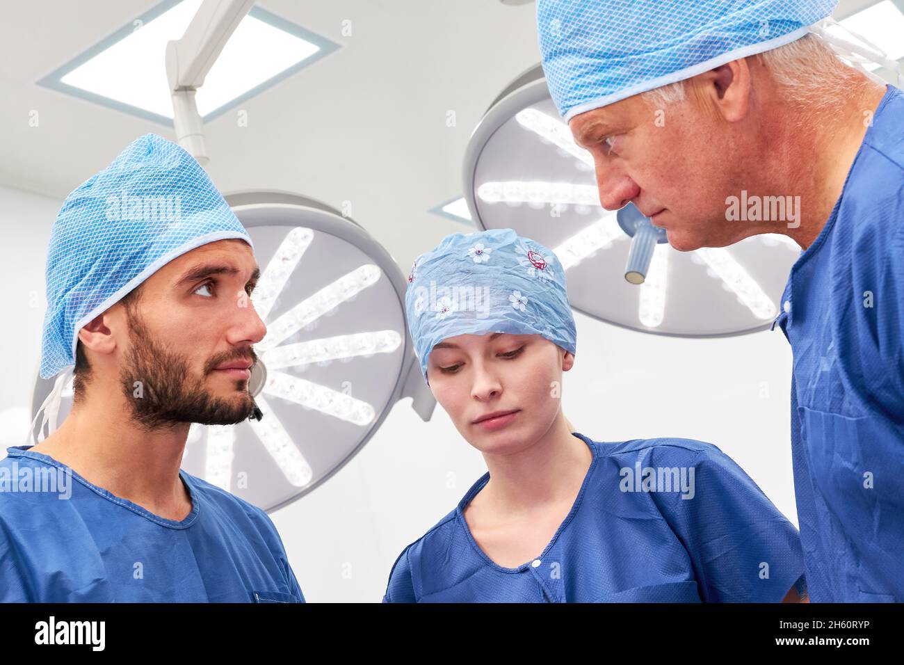 Doctors team with assistant doctor and operating room nurse in surgery ...