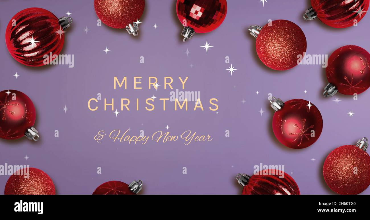 Image of merry christmas text over baubles and snow falling Stock Photo ...
