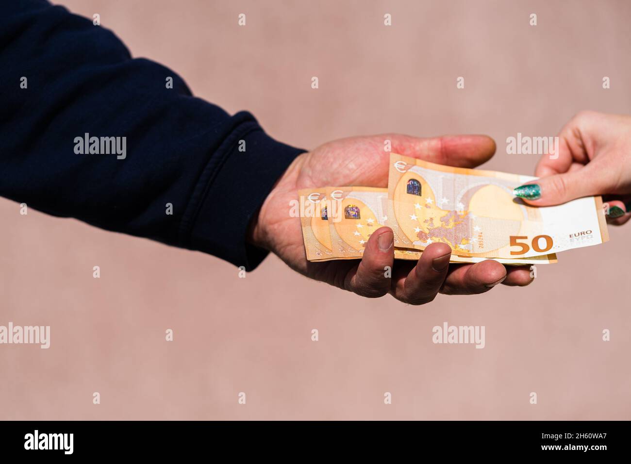 Hand giving money, 50 EURO banknotes Stock Photo - Alamy