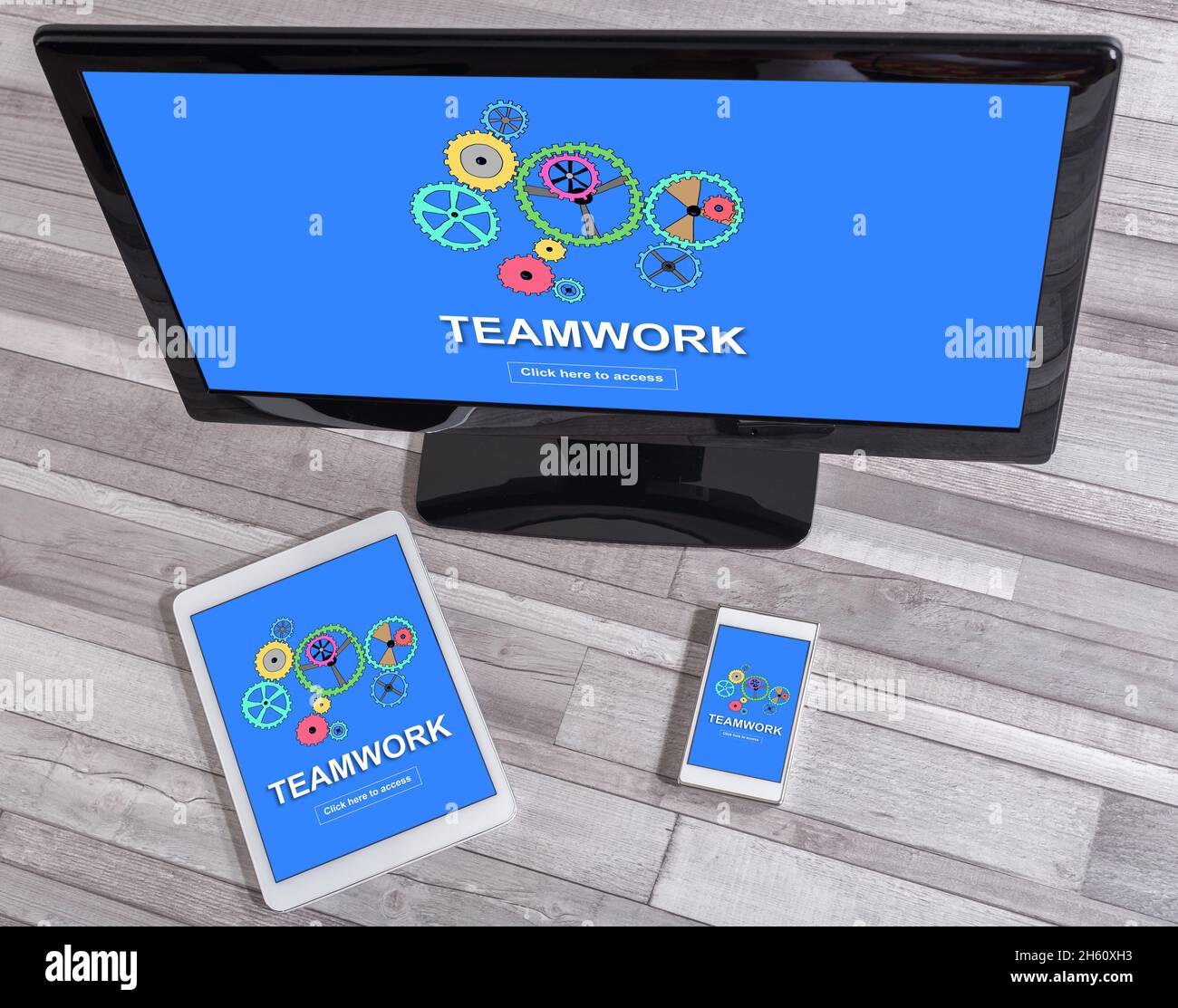 Teamwork concept shown on different information technology devices ...