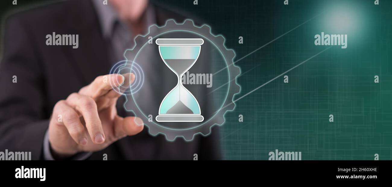Man touching a time management concept on a touch screen with his ...