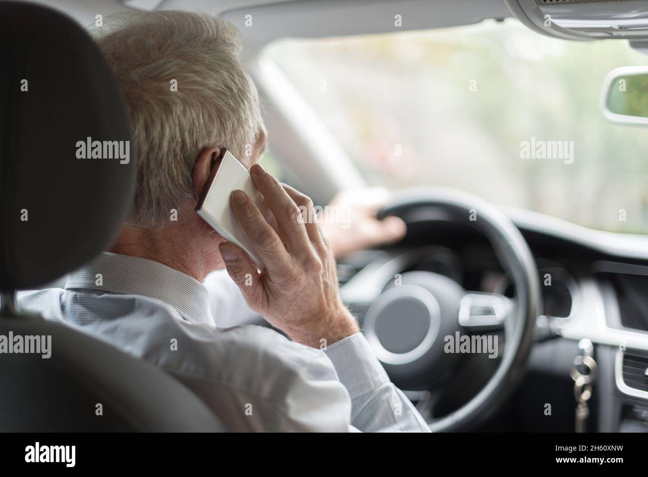 Man phoning while driving Stock Photo - Alamy