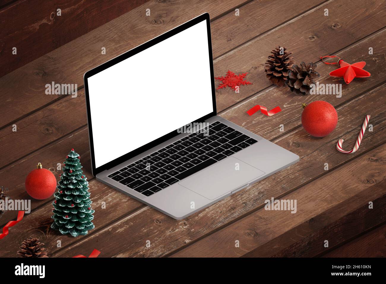 Laptop mockup on wooden desk surrounded by Christmas decorations ...