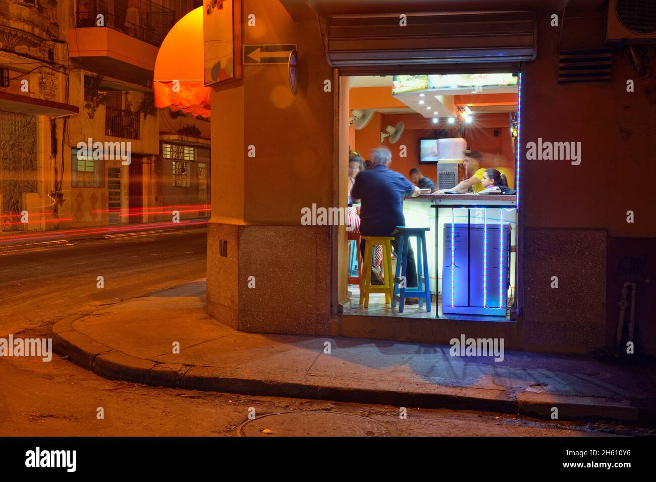 Street scene in central Havana. Open bar at night on Calle Neptuno, La ...