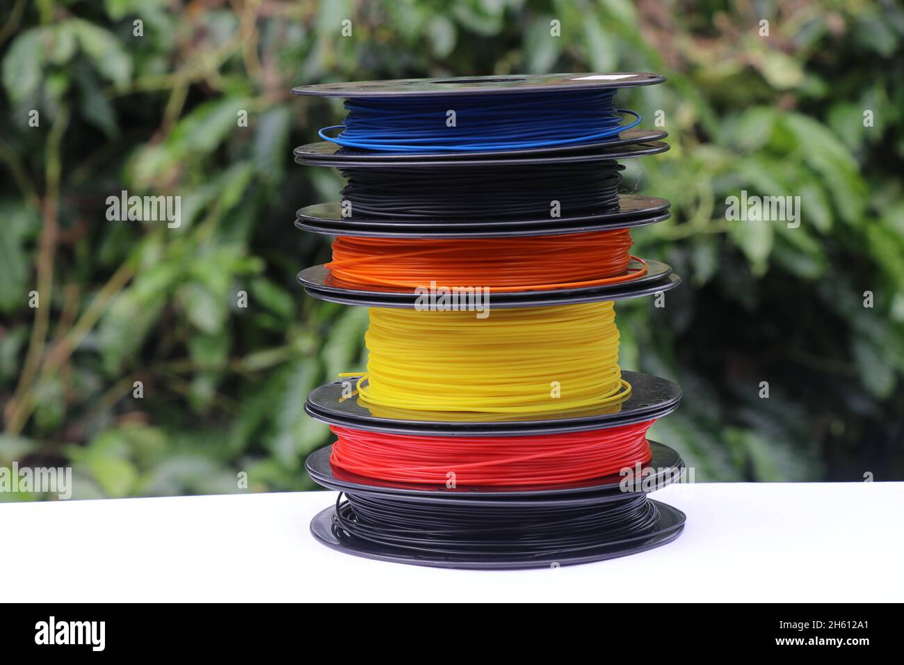 Stack of plastic filaments in a spool used for rapid prototype ...