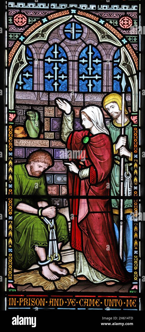A stained glass window by Frederick Preedy depicting Acts of Mercy, St ...