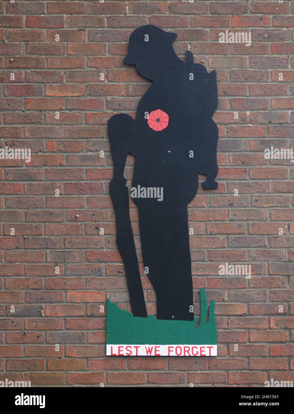 Figure of a two dimensional soldier with a red poppy and the message ...