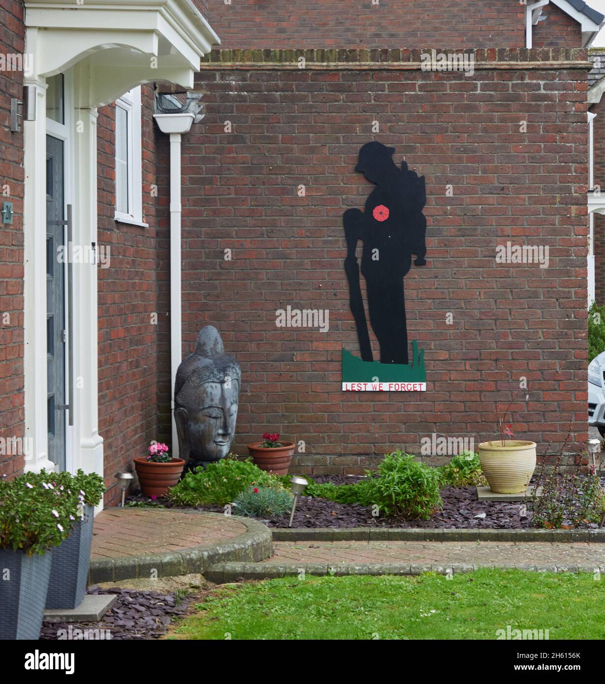 Figure of a two dimensional soldier with a red poppy and the message ...