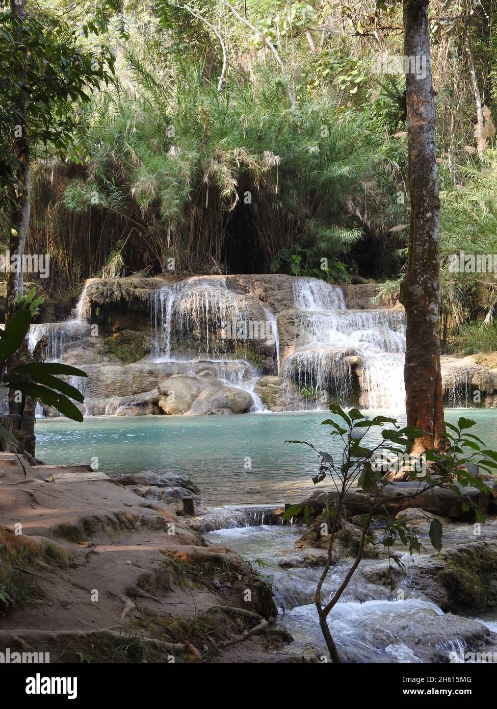 Flipped vertical shot of the scenic Kuang Si Waterfall (Kuang Xi Falls ...