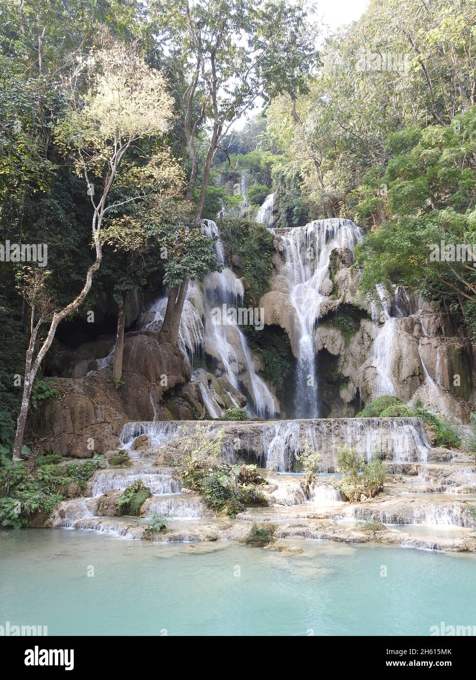 Flipped vertical shot of the scenic Kuang Si Waterfall (Kuang Xi Falls ...