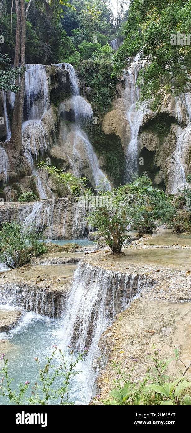 Flipped vertical shot of the scenic Kuang Si Waterfall (Kuang Xi Falls ...