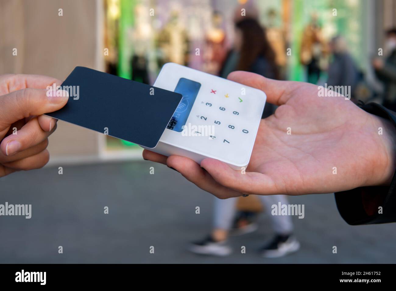 Anonymous client paying to seller with contactless credit card on ...