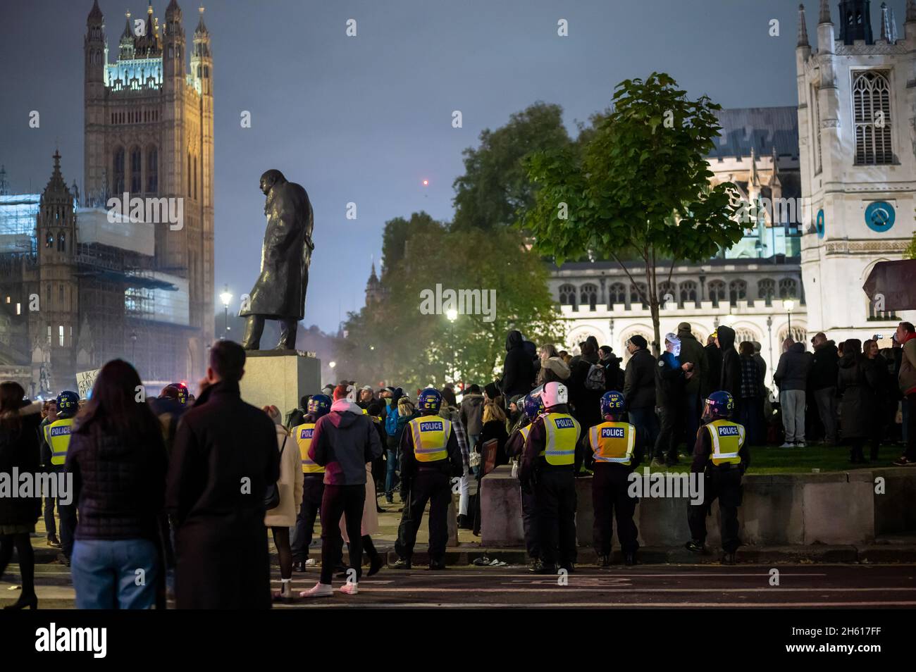 LONDON - NOVEMBER 1, 2021: Police protect statue of Winston Churchill ...