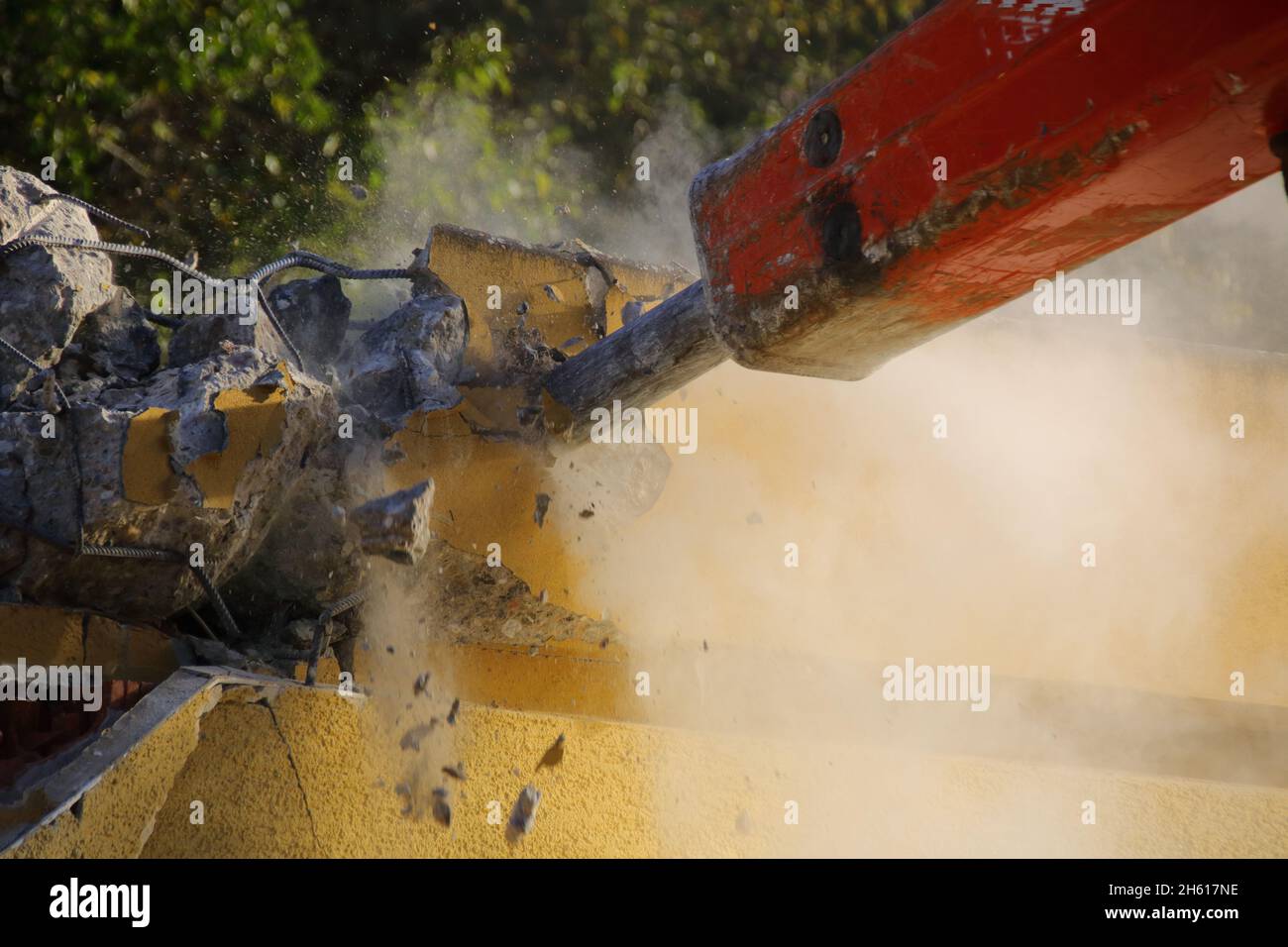 Demolition of a house wall with a large chisel Stock Photo - Alamy