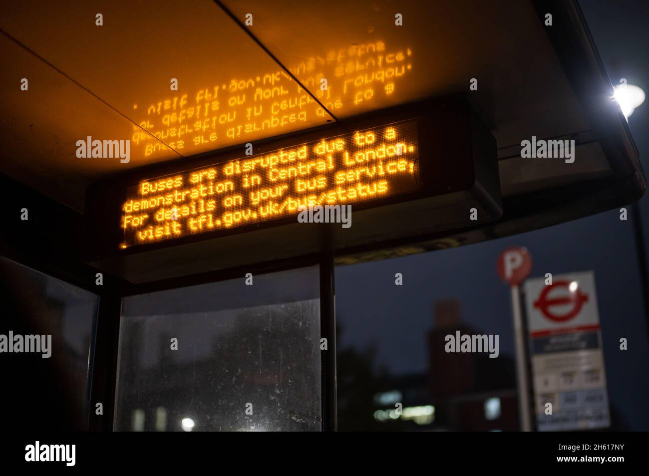 LONDON - NOVEMBER 1, 2021: Illuminated sign at a bus stop warning of ...