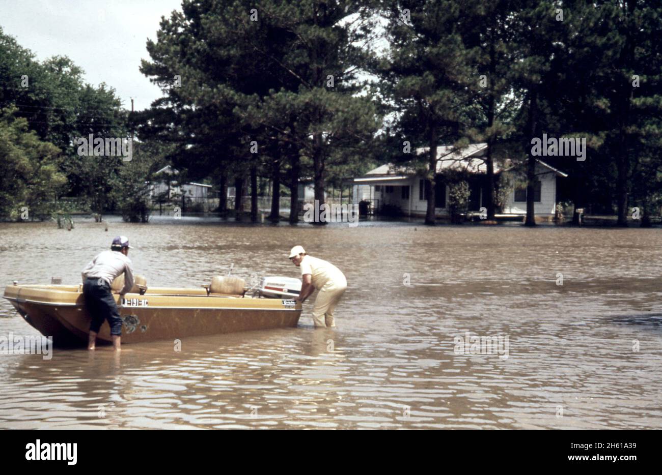 Men using boat during flooding hi-res stock photography and images - Alamy