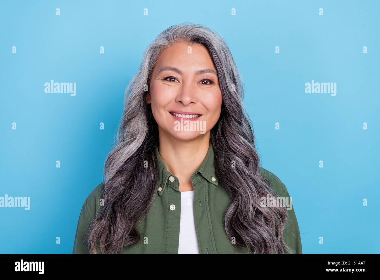 Photo of sweet adorable retired woman wear green shirt smiling isolated ...
